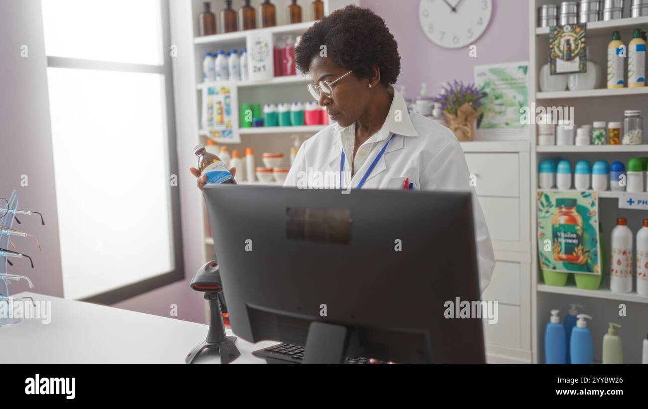Beautiful african american woman with curly hair working in a bright ...