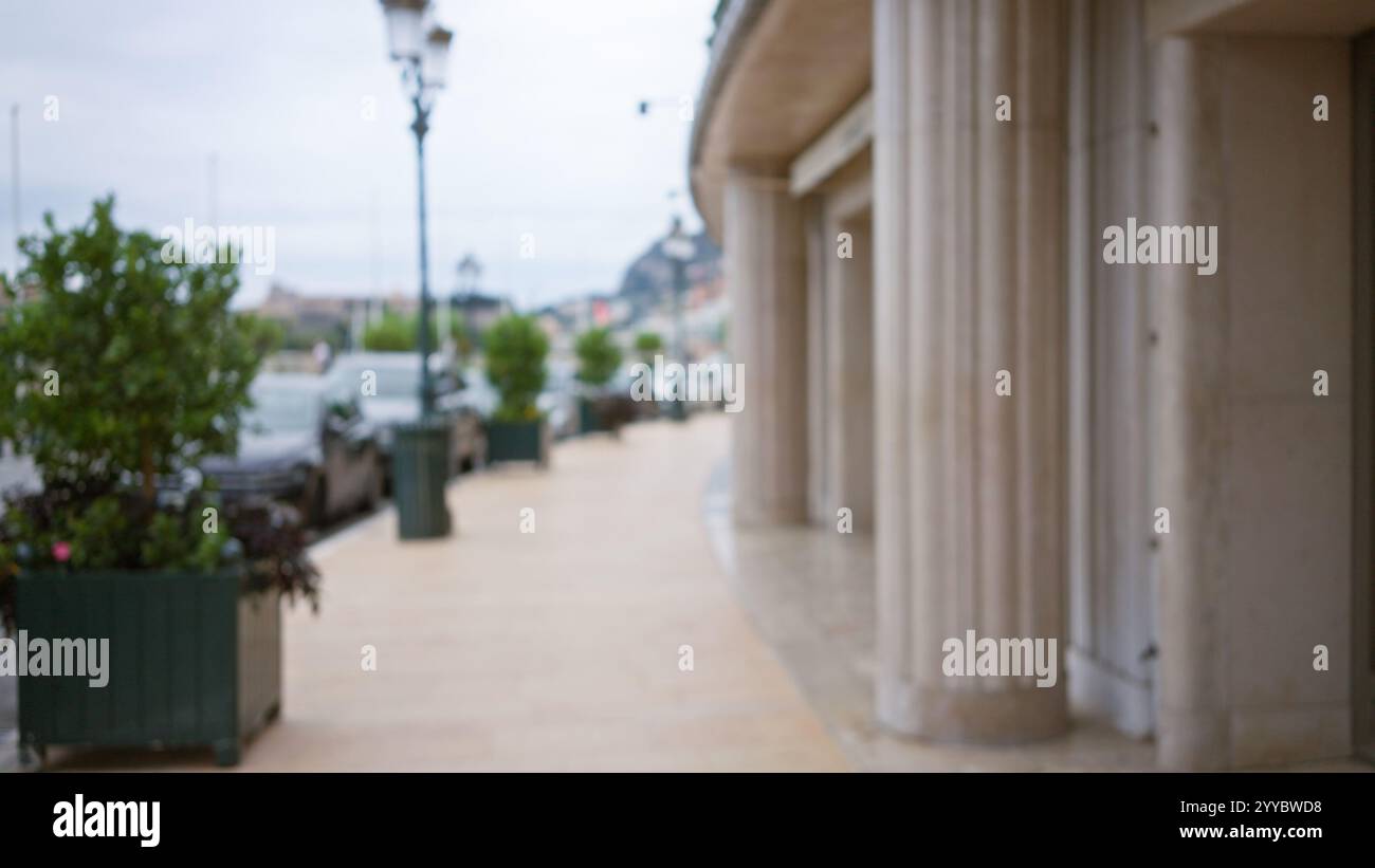 Blurred street scene in monaco with luxury vibe featuring potted plants ...