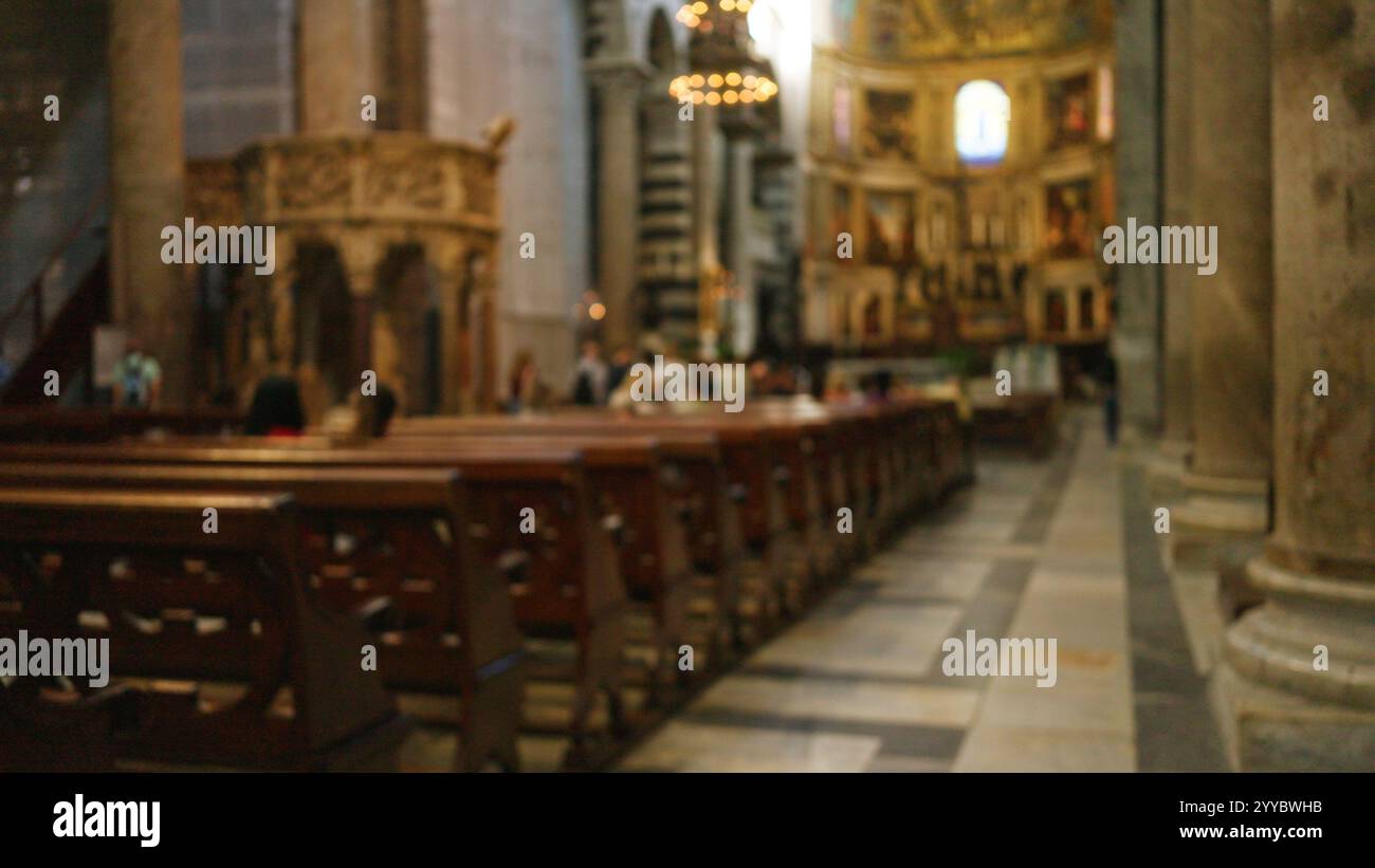 Blurred church interior with defocused pews and religious decor ...