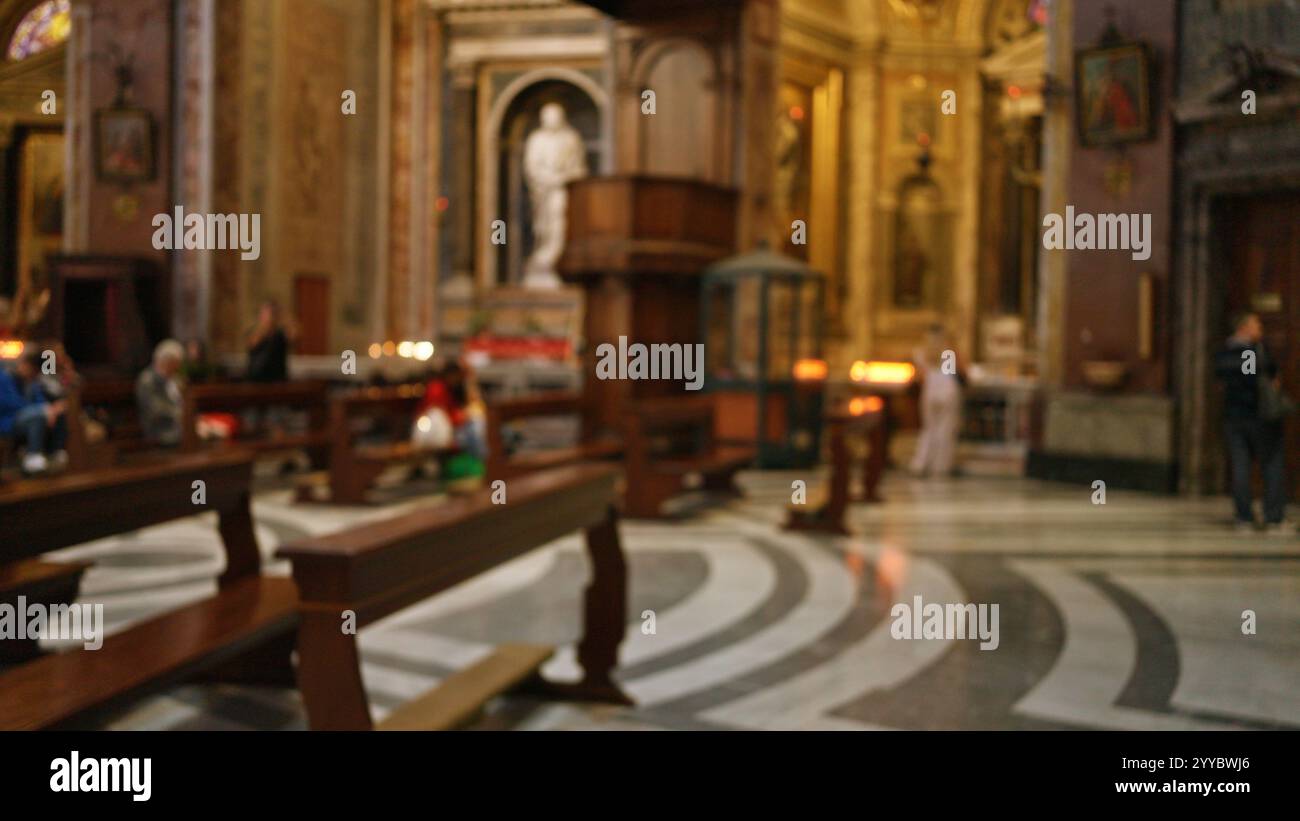 Blurred interior view of church with defocused people sitting on ...