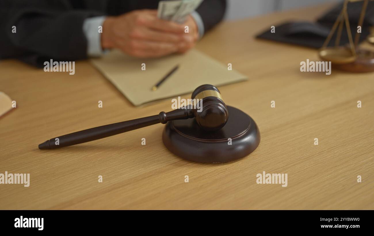 Judge counting money at a desk illustrating bribery with a gavel and ...