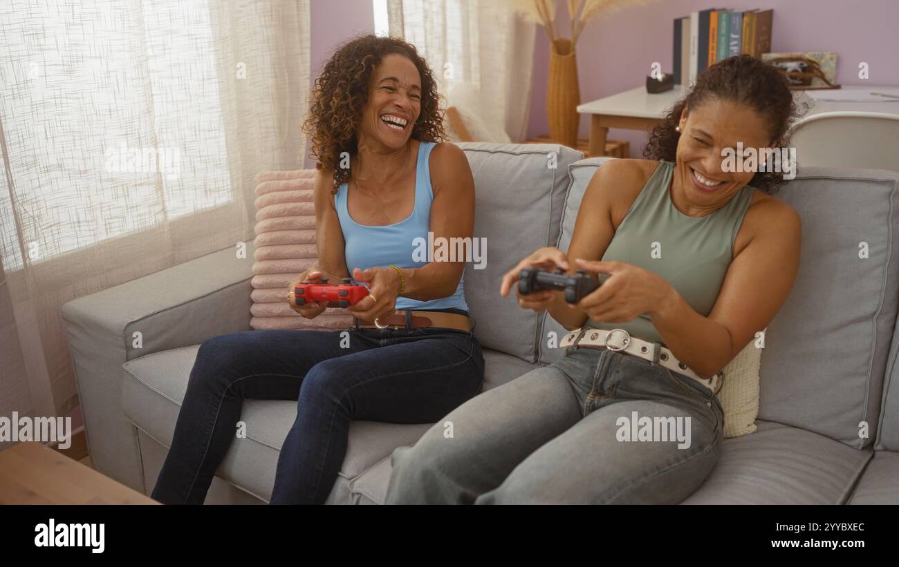 Two women enjoying time together playing video games in a cozy living ...