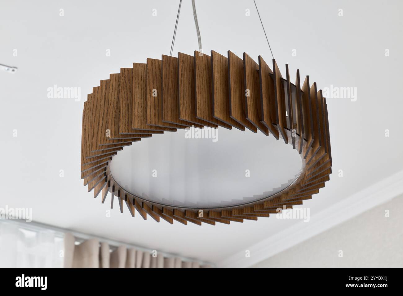 A unique and modern pendant light fixture that features a beautifully ...