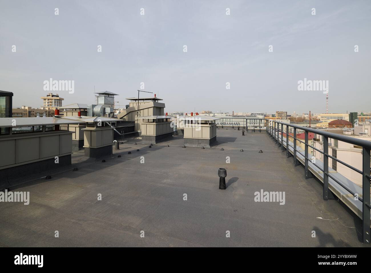 A captivating panoramic view of an urban rooftop featuring industrial ...