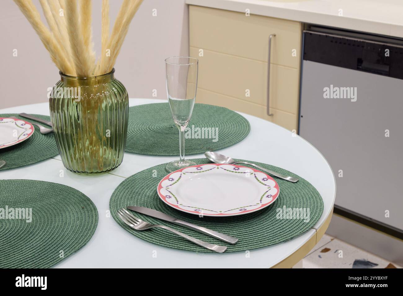 An Elegant Dining Table Setting featuring Beautiful Green Accents that ...
