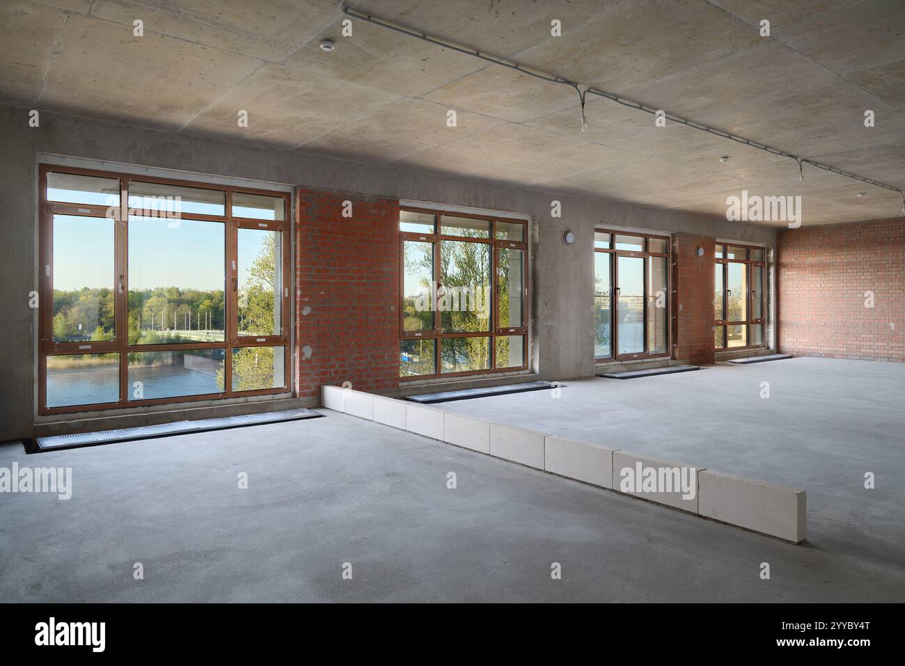 A modern minimalist interior that features stunning panoramic windows ...