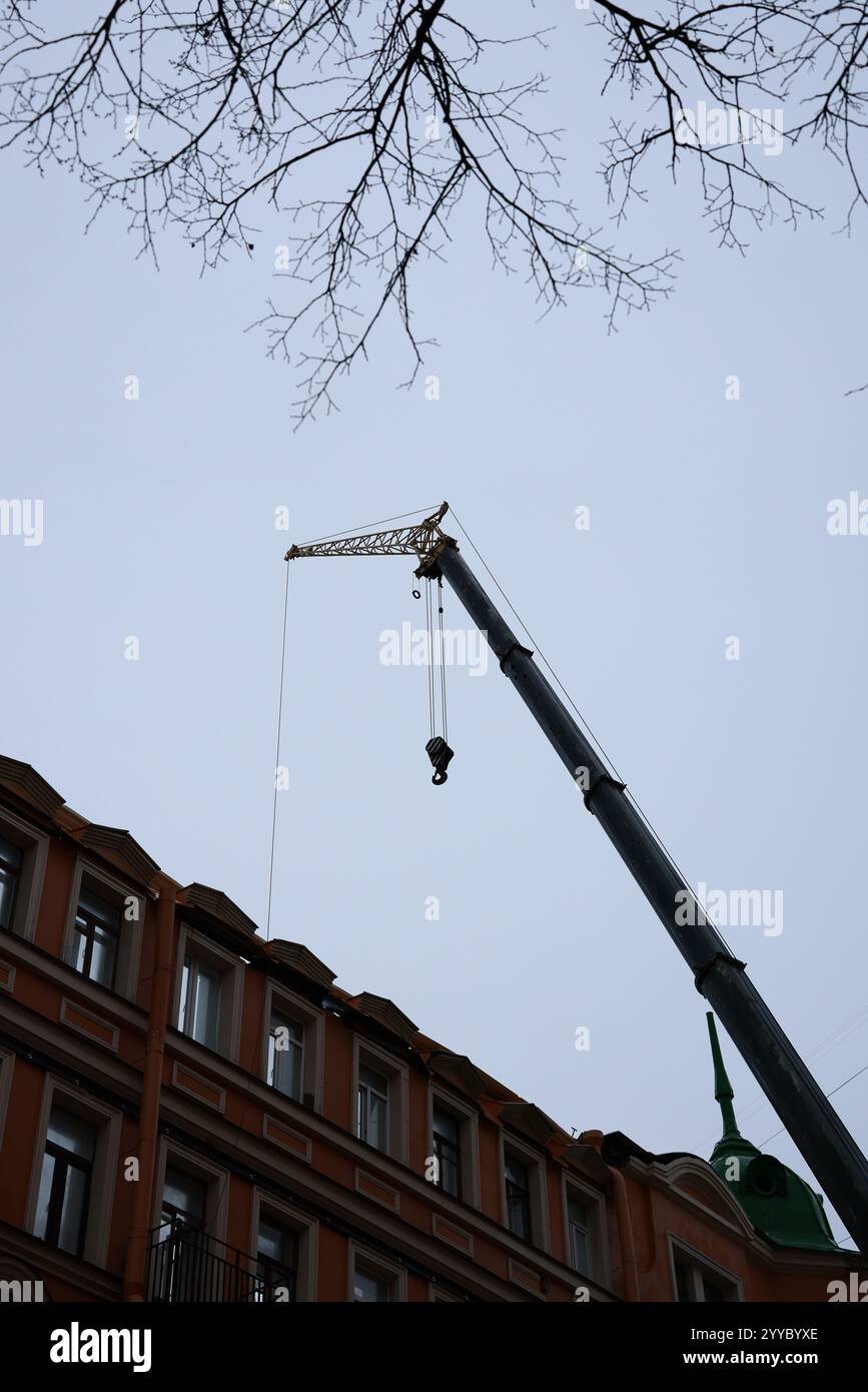An Overhead Crane in Operation During a Building Renovation Project ...