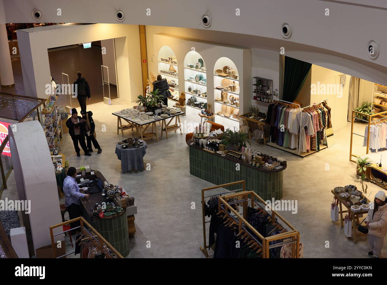 A stylish retail space that elegantly showcases clothing alongside ...