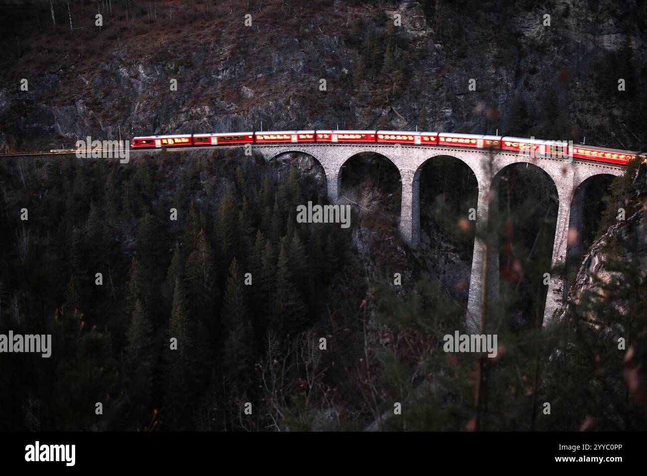 Chur. 1st Dec, 2024. A train runs on the Landwasser Viaduct along the ...