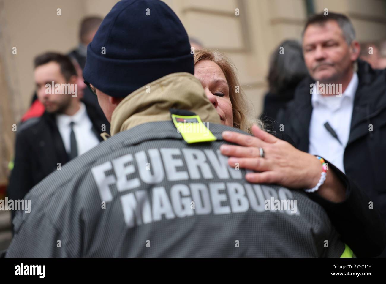 German Interior Minister Nancy Faeser thanks a firefighter as she ...