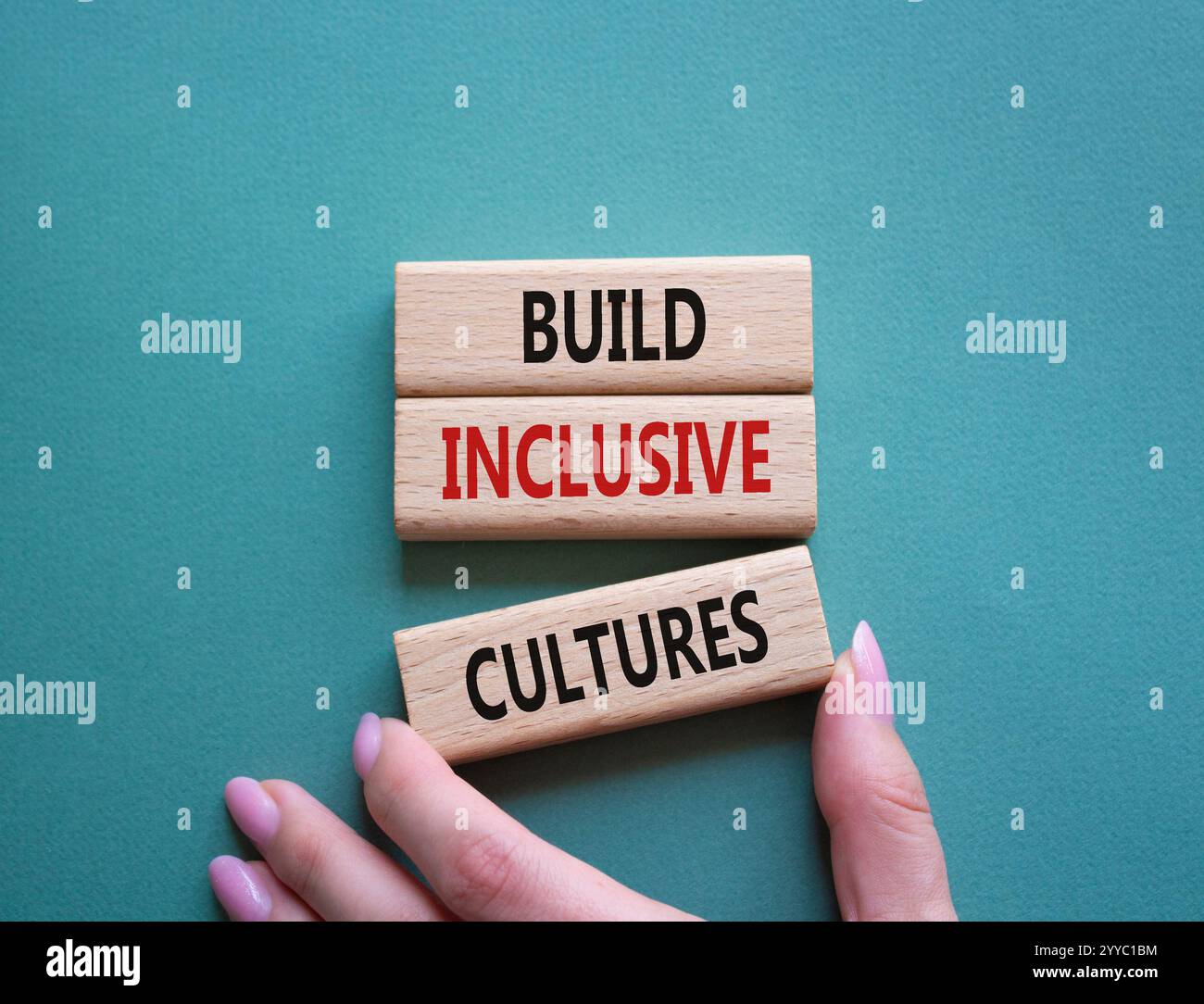 Build Inclusive Cultures symbol. Wooden blocks with words Build ...