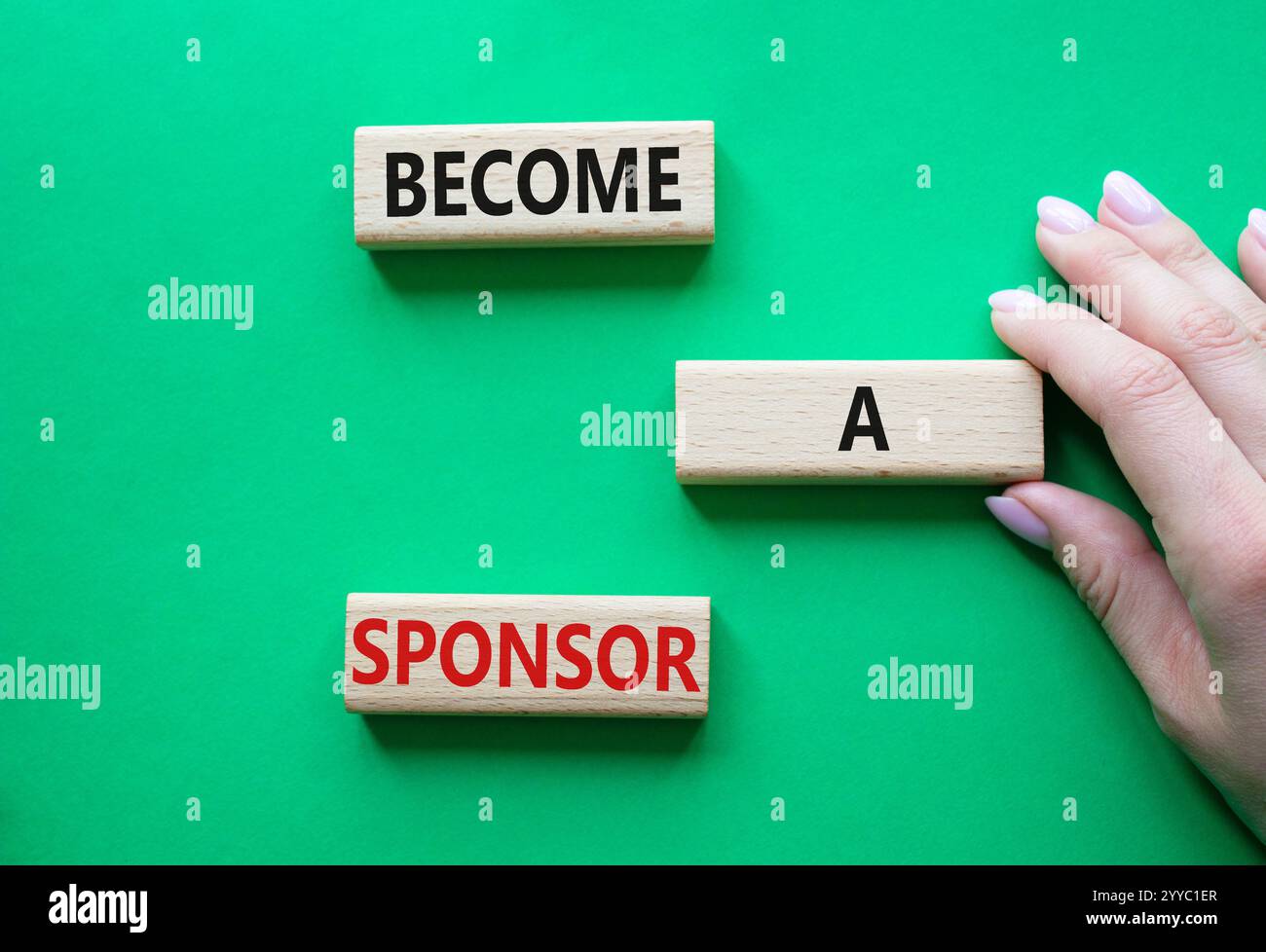 Become a sponsor symbol. Concept word Become a sponsor on wooden blocks ...