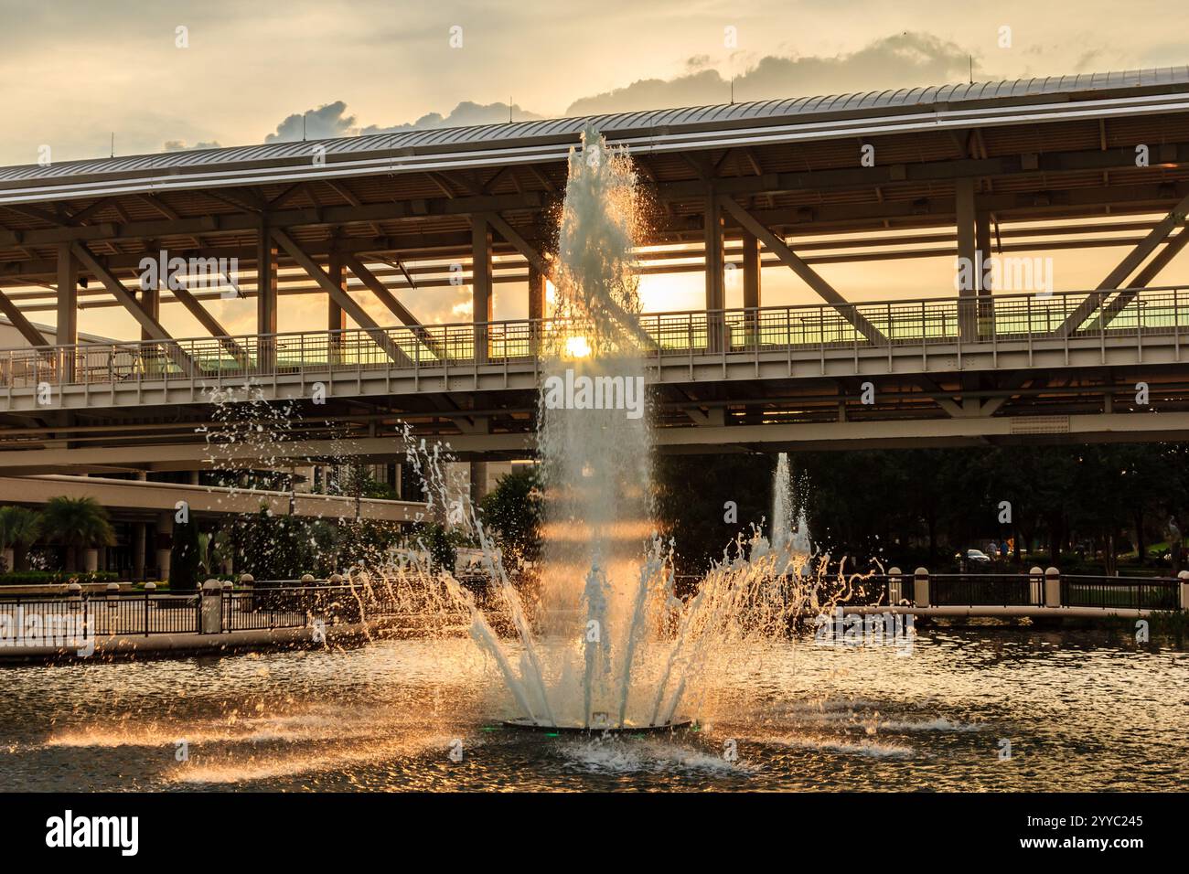 A large fountain with water shooting up into the air. The water is ...