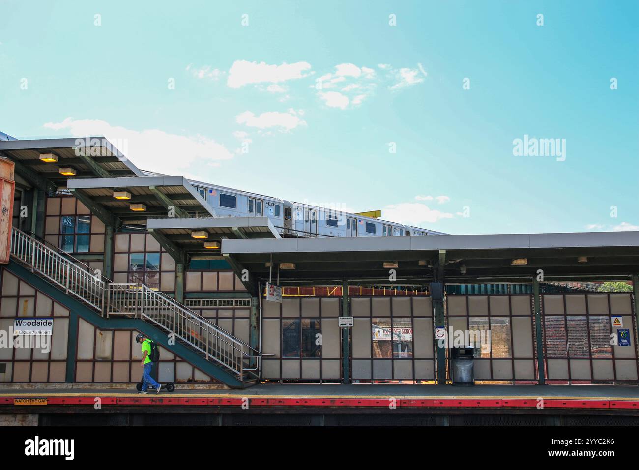 Woodside, Queens, USA - 20 August 2024: A worker walks at Woodside ...