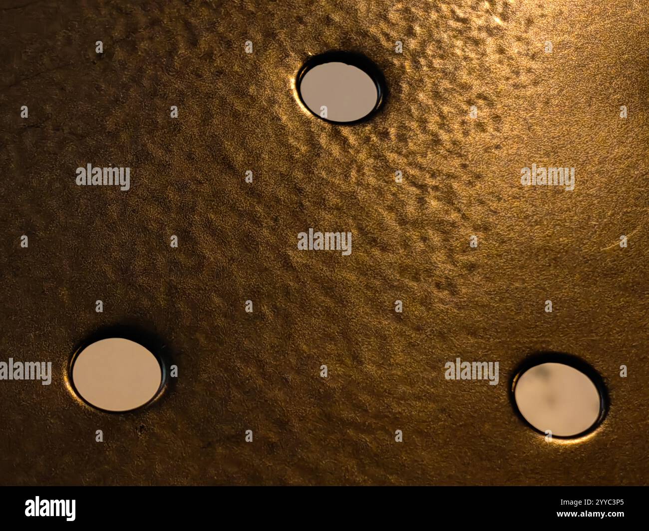 Triangle in the Making: Three Holes on a Metal Surface Stock Photo - Alamy