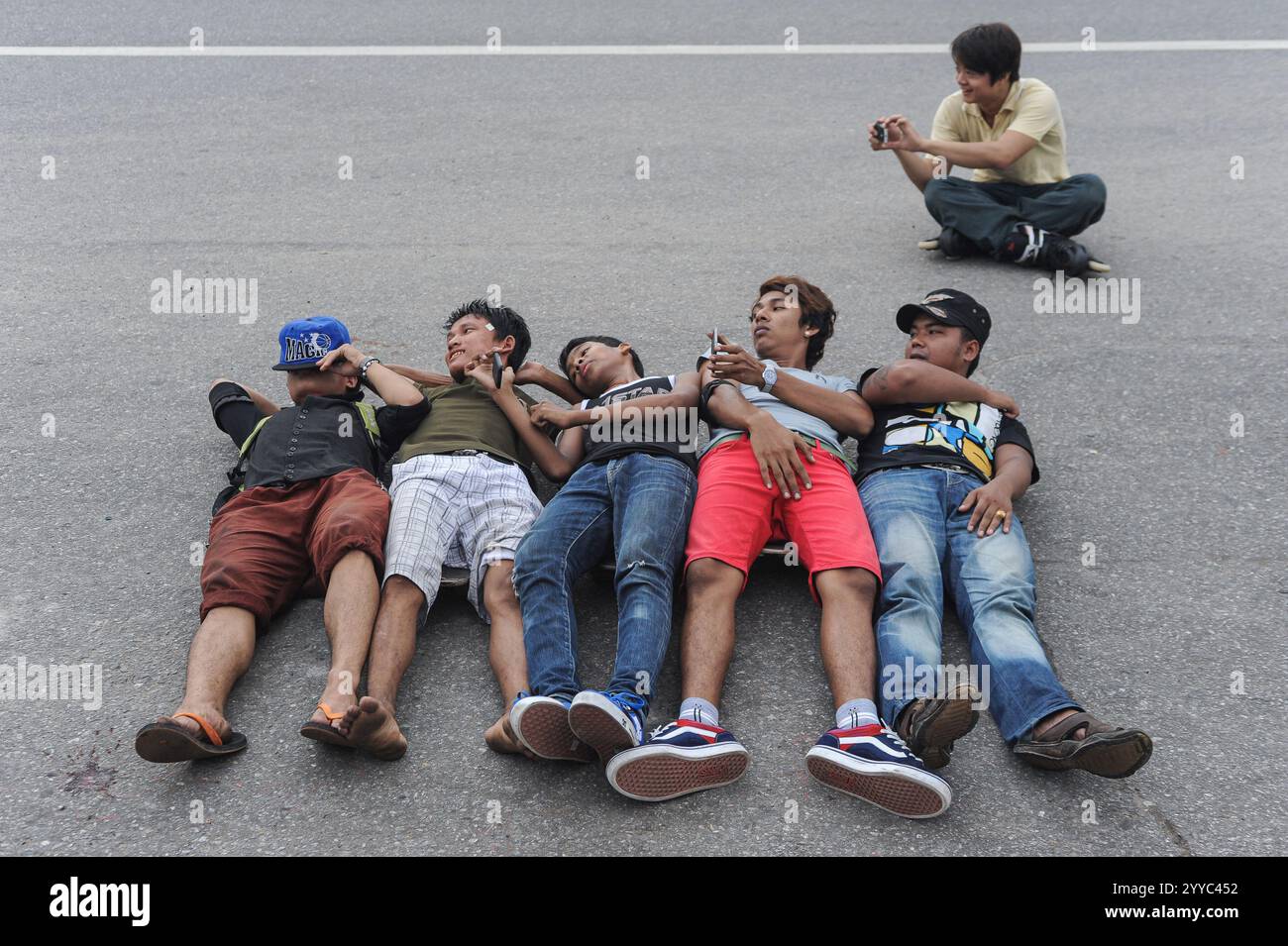 09.08.2013, Yangon, Myanmar, Asia - Youths of the Gen Z lie closely ...