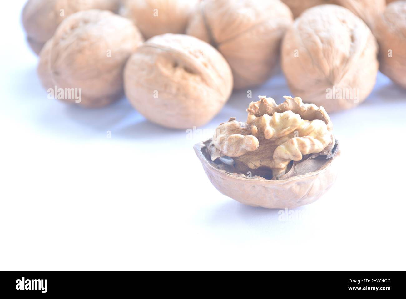 baked crispy walnut peel out arranging on white background Stock Photo ...
