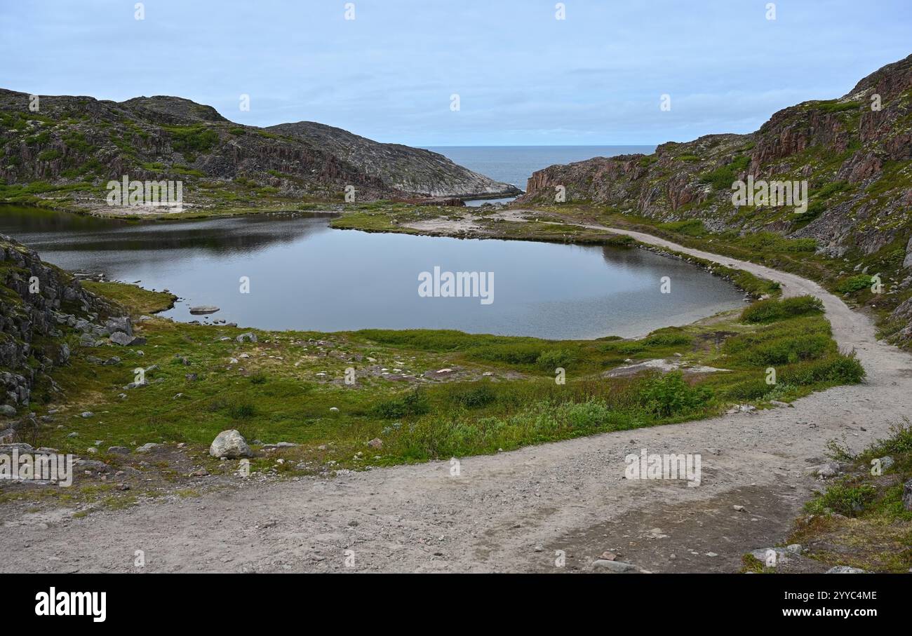 Northern landscape of lakes and tundra with a rear view of the Barents Sea in the Teriberka area ...
