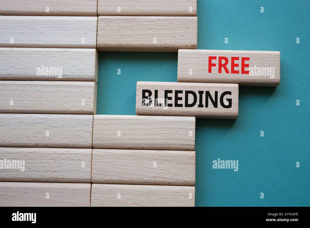 Free bleeding symbol. Concept words Free bleeding on wooden blocks ...