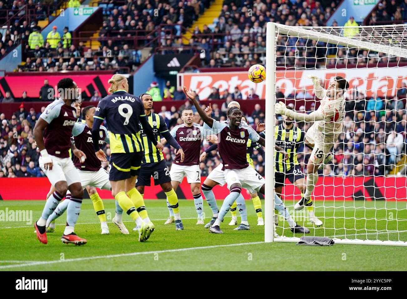 Manchester City goalkeeper Stefan Ortega (right) saves a shot on goal ...