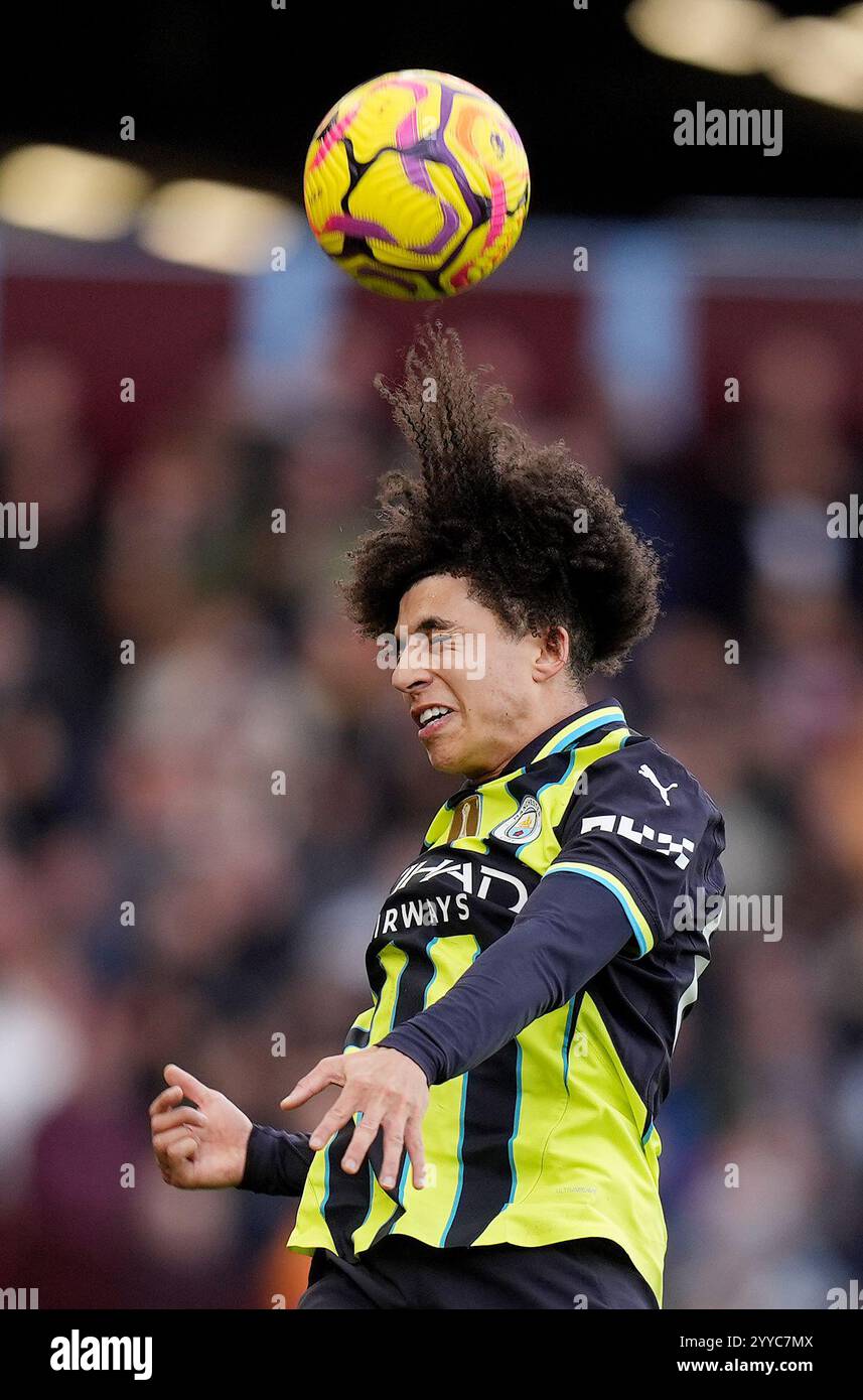 Manchester City's Rico Lewis heads the ball during the Premier League ...