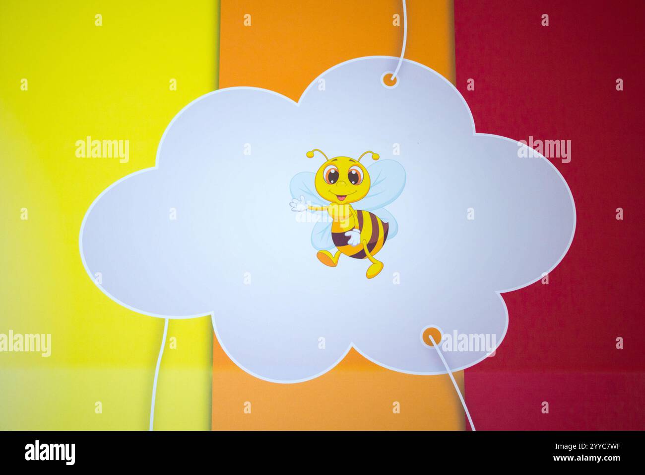 A cheerful cartoon bee with a wide smile flies in a playful cloud shape ...