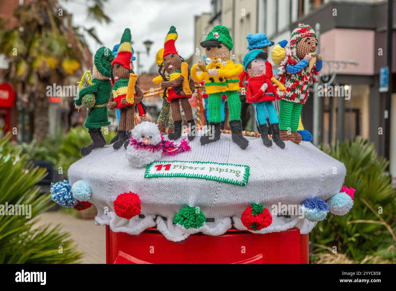 A knitted letter box decoration of Eleven Pipers Piping in Exmouth ...