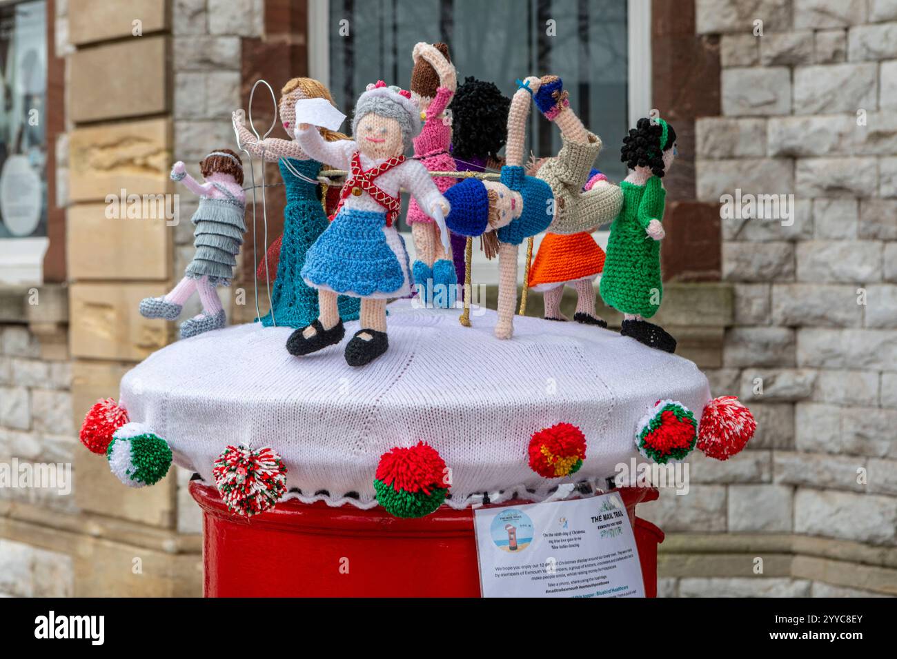 A knitted letter box decoration of Nine Ladies Dancing in Exmouth ...