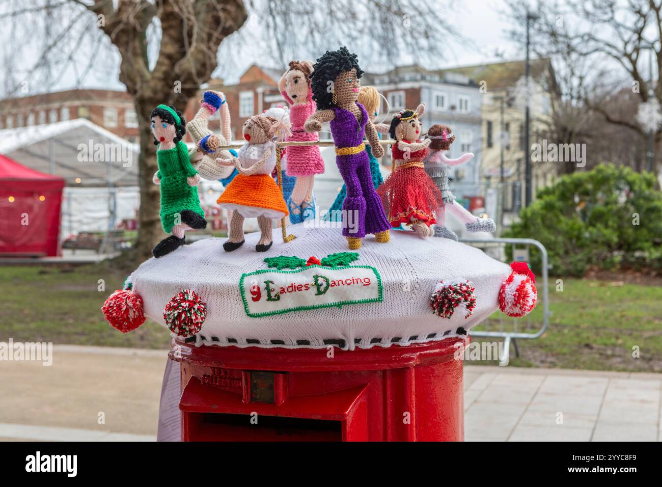 A knitted letter box decoration of Nine Ladies Dancing in Exmouth ...