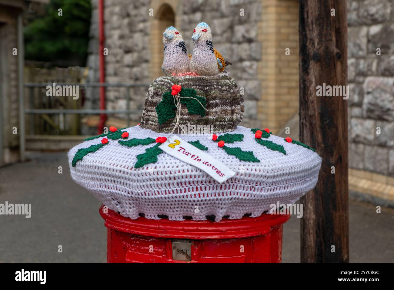 A knitted letter box decoration of Two Turtle Doves in Exmouth, Devon ...