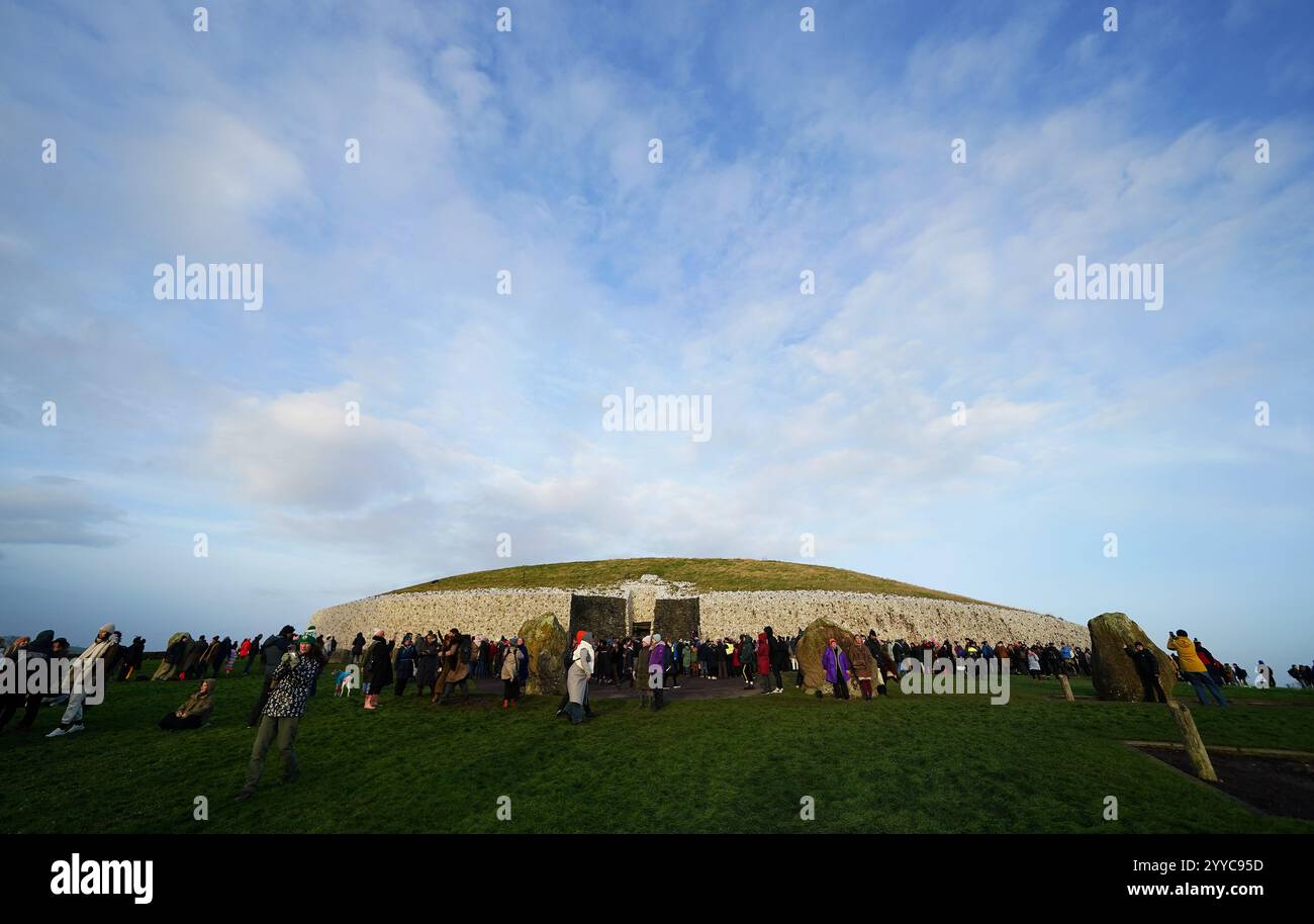 People gather for sunrise at Newgrange, Co. Meath, on the morning of ...