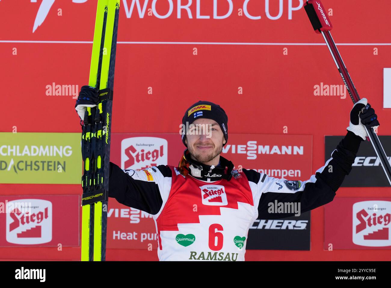 Ilkka Herola, of Finland, celebrates on the podium after finishing ...