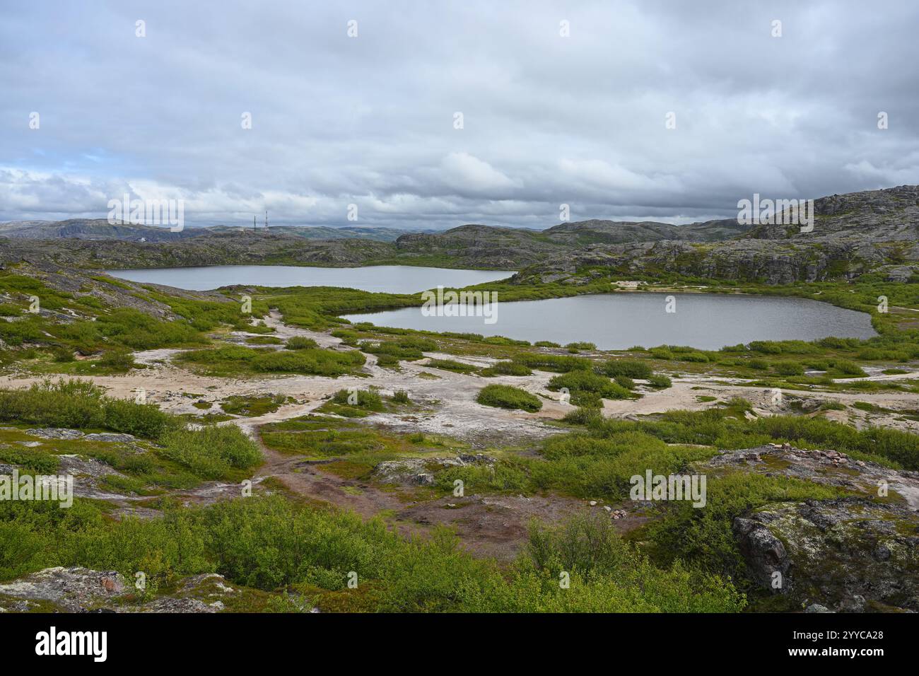 Northern landscape with a lakes and tundra surrounded by hills on the ...