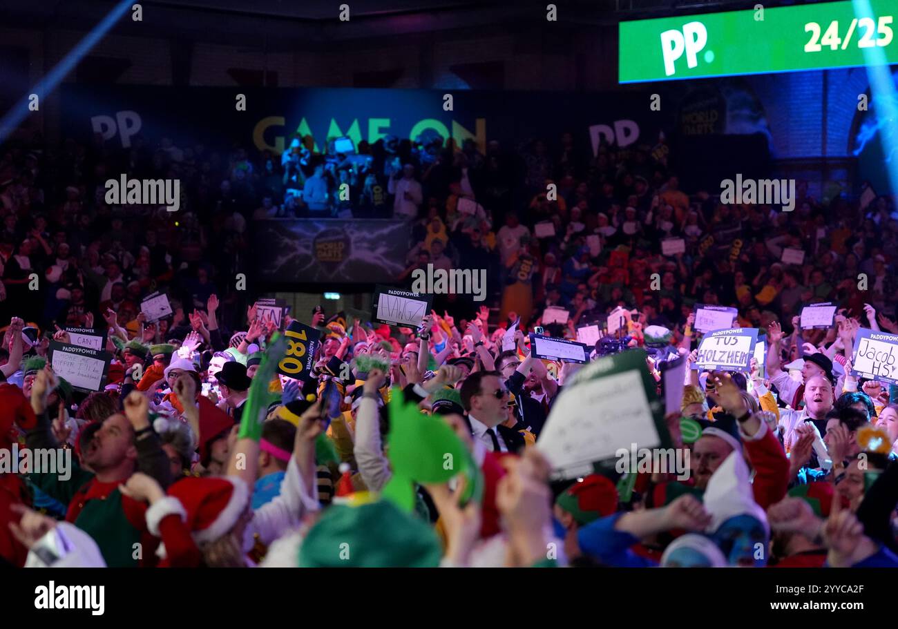 A general view of spectators in fancy dress in the crowd during day ...