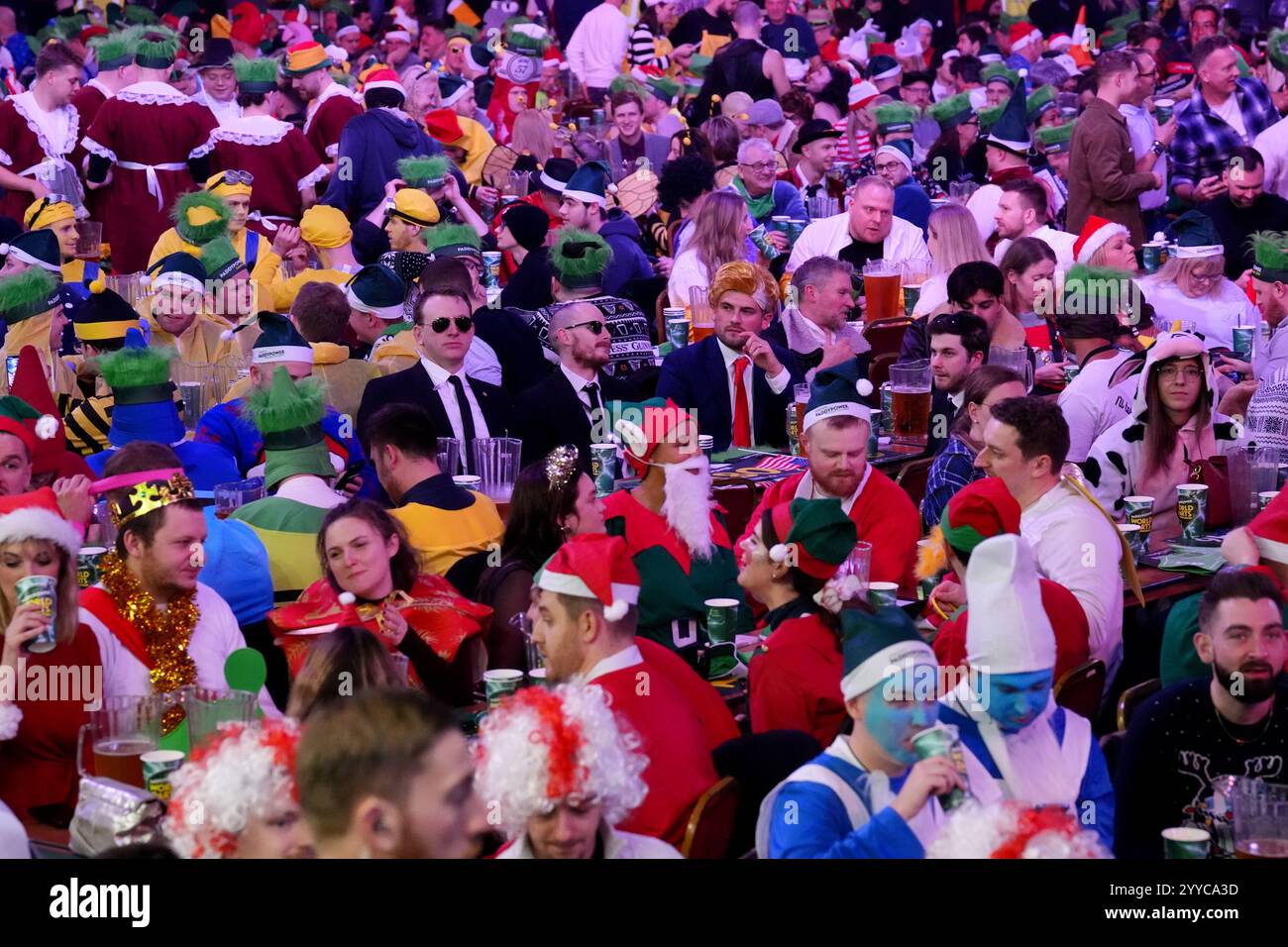 A general view of spectators in fancy dress in the crowd during day ...