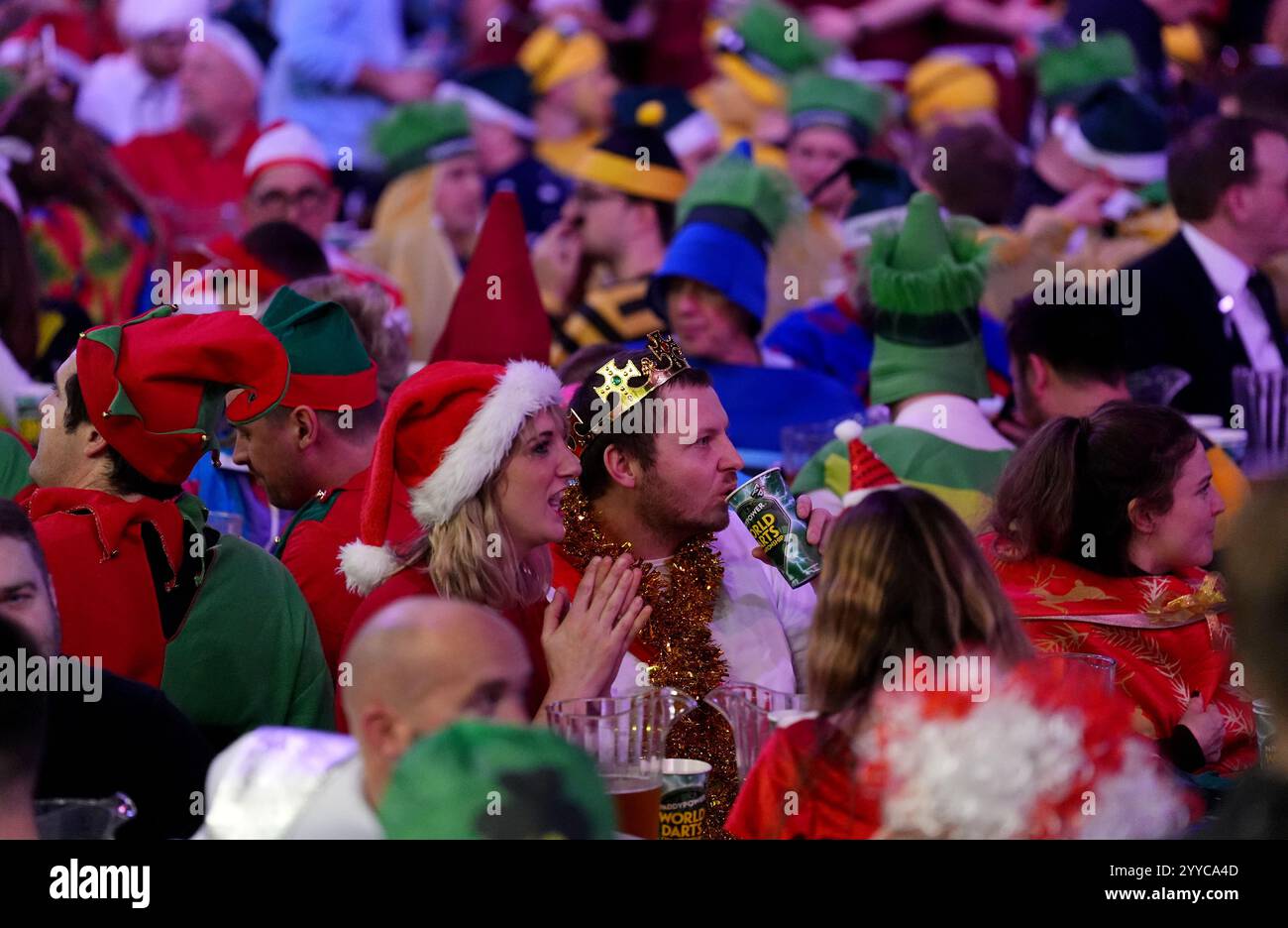 A general view of spectators in fancy dress in the crowd during day ...
