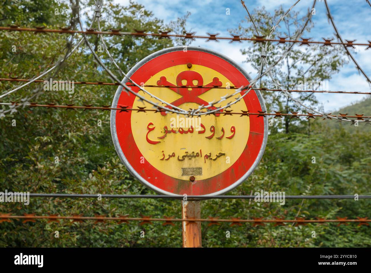 Gilan Province, Iran - September 28, 2024: A warning sign at the Iran ...