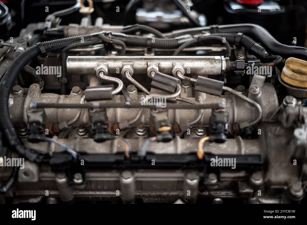 Detailed view of fuel injectors and engine components, showcasing the ...