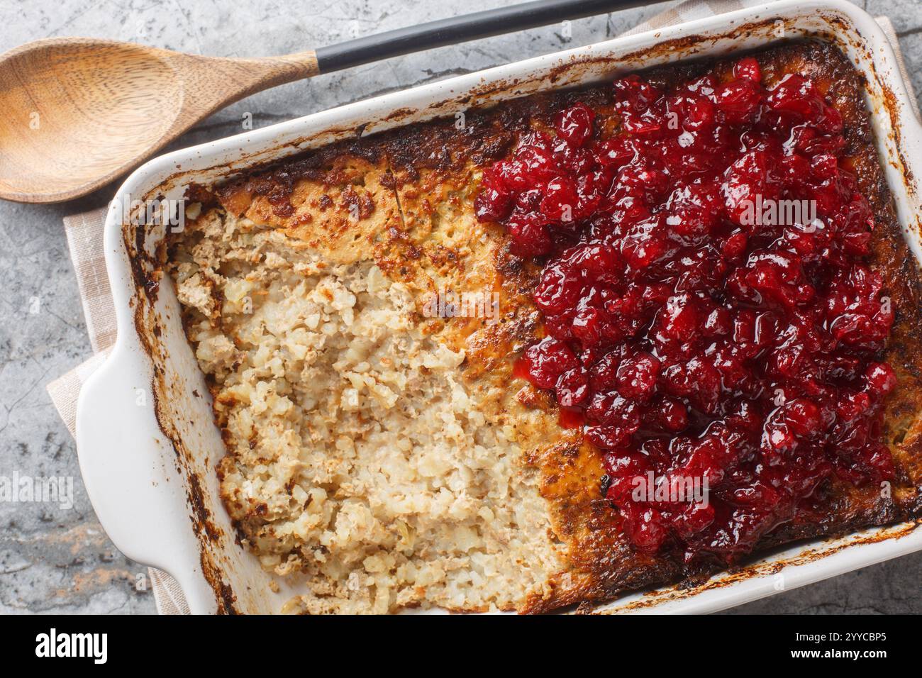 Slow baked creamy rice liver casserole served with cranberry jam close ...