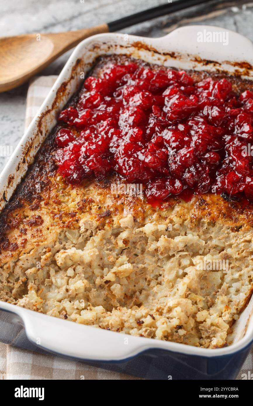 Rice and liver casserole Maksalaatikko with Cranberry sauce closeup on ...