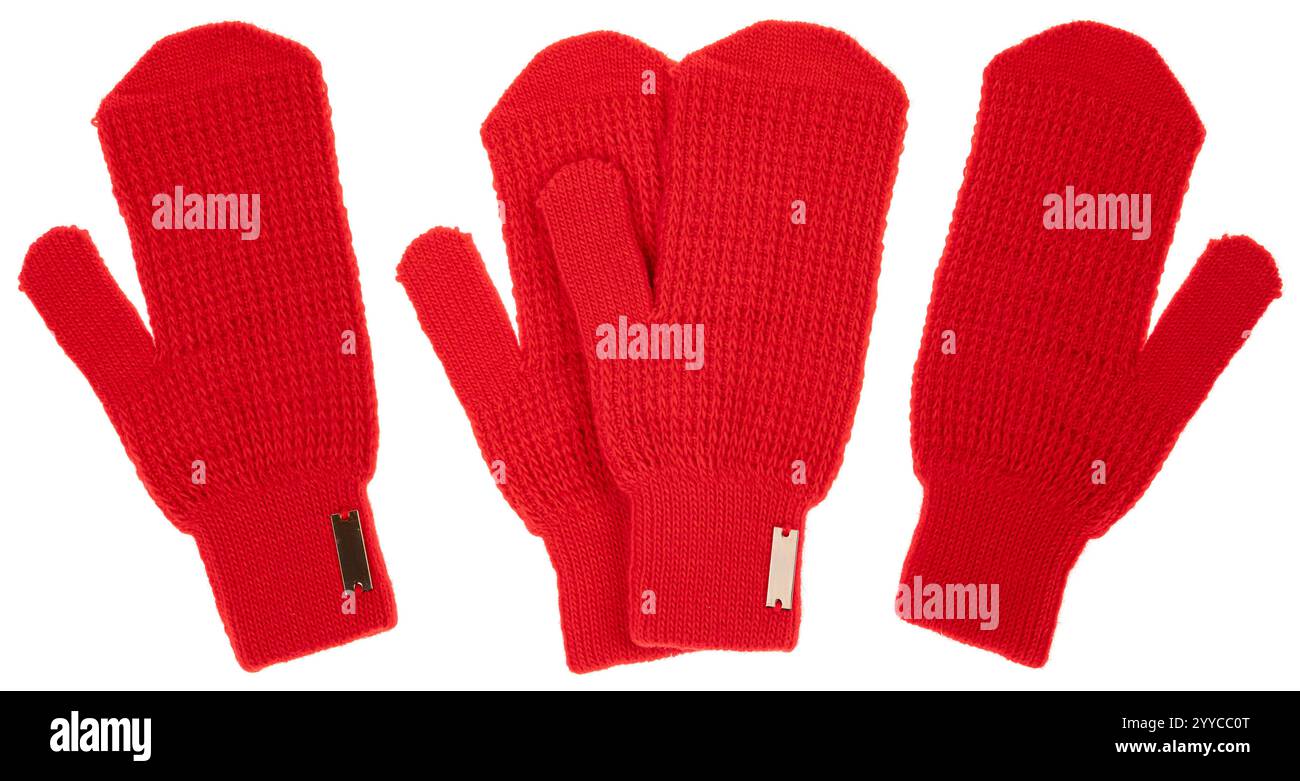 A set of bright red knitted mittens isolated on a white background ...