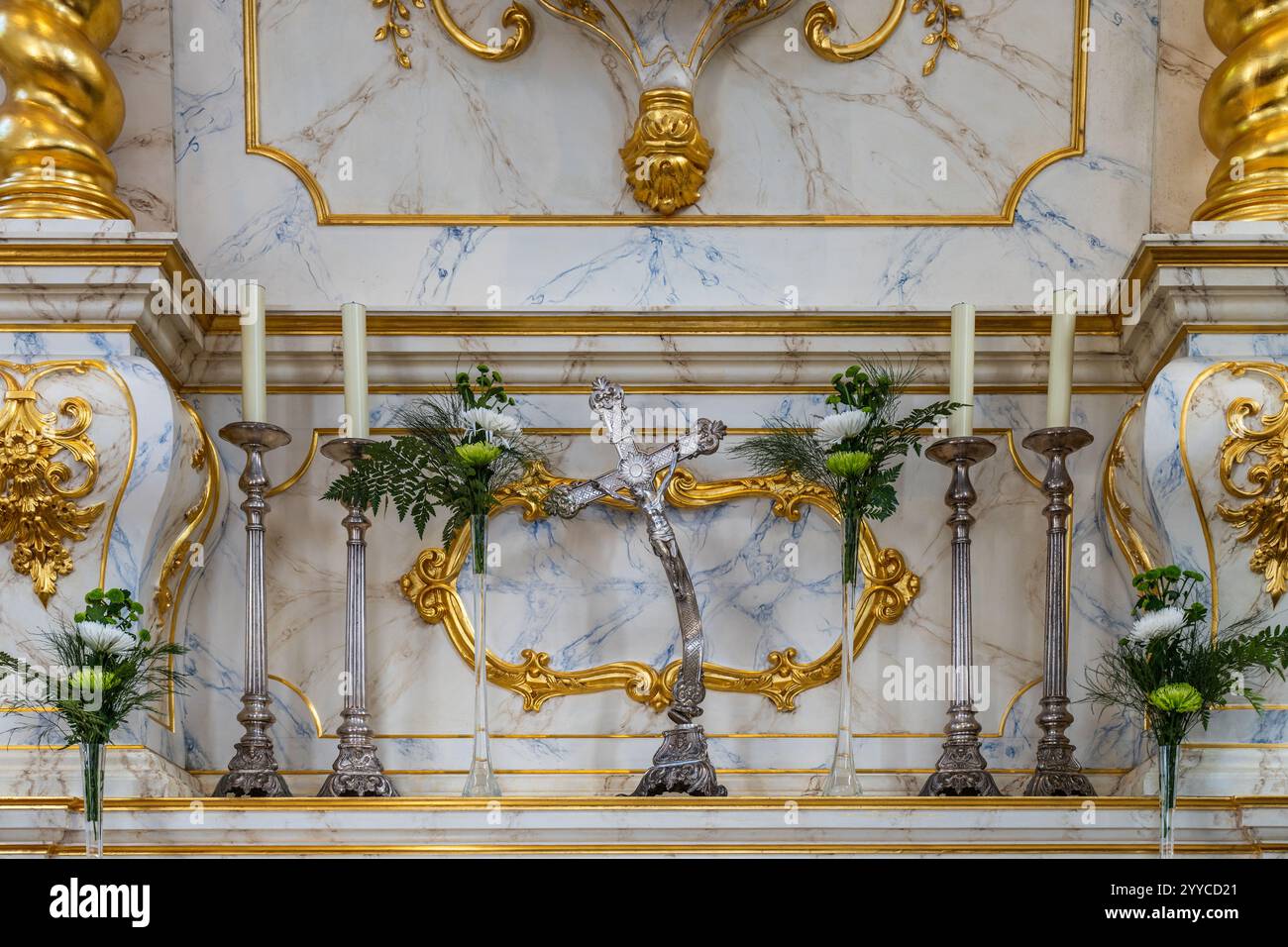 Marble church altar adorned with golden ornaments, religious statues ...