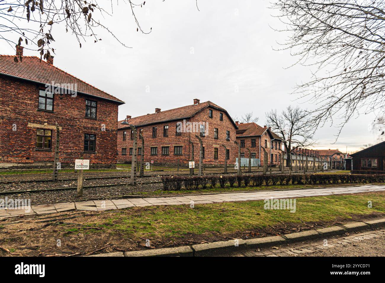 Brick Barracks Beyond Barbed Wire at Auschwitz I Stock Photo - Alamy