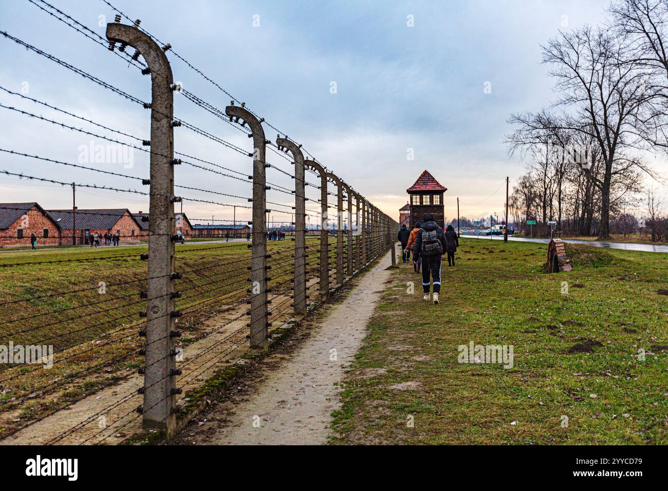 Brick Barracks Seen Through Barbed Wire at Auschwitz-Birkenau Stock ...