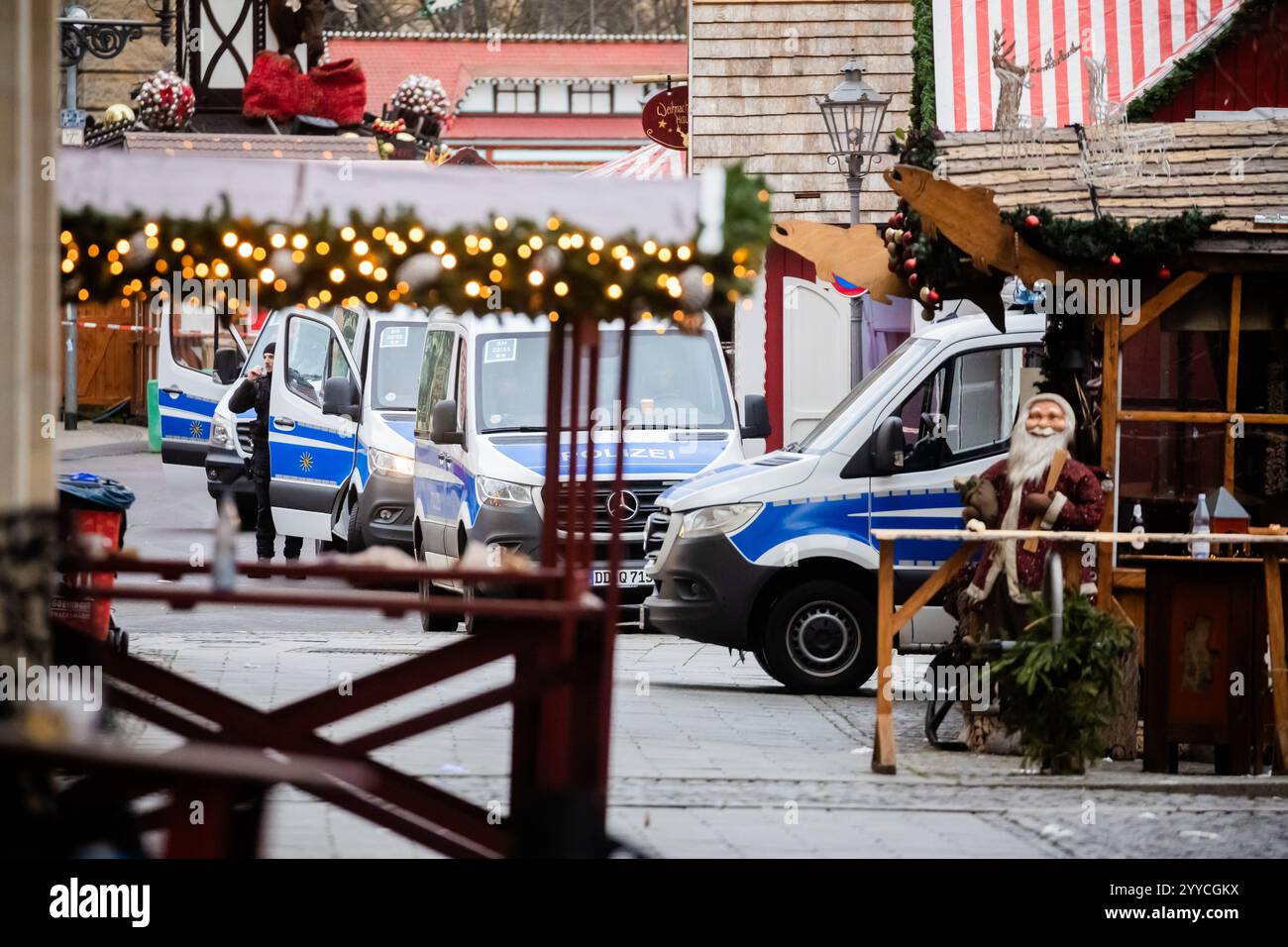Magdeburg, Germany. 21st Dec, 2024. Police vehicles at the Christmas ...