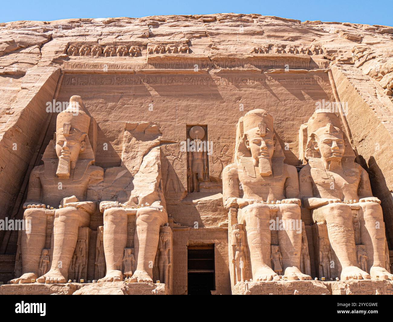 Four statues of Ramesses II in front of the Great Temple of Ramesses II ...