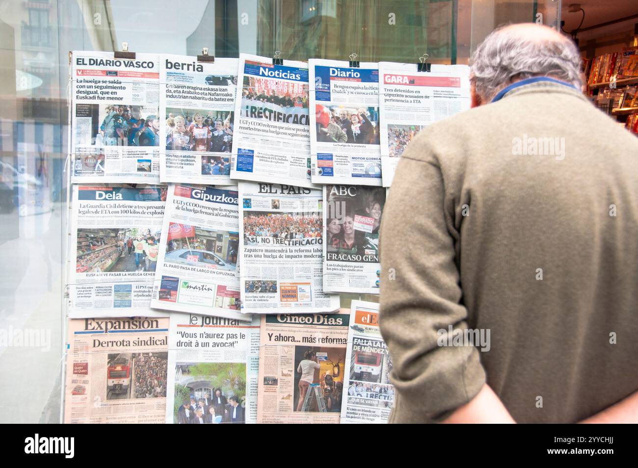 Senior men look at newspapers. San Sebastian. Historic centre ...