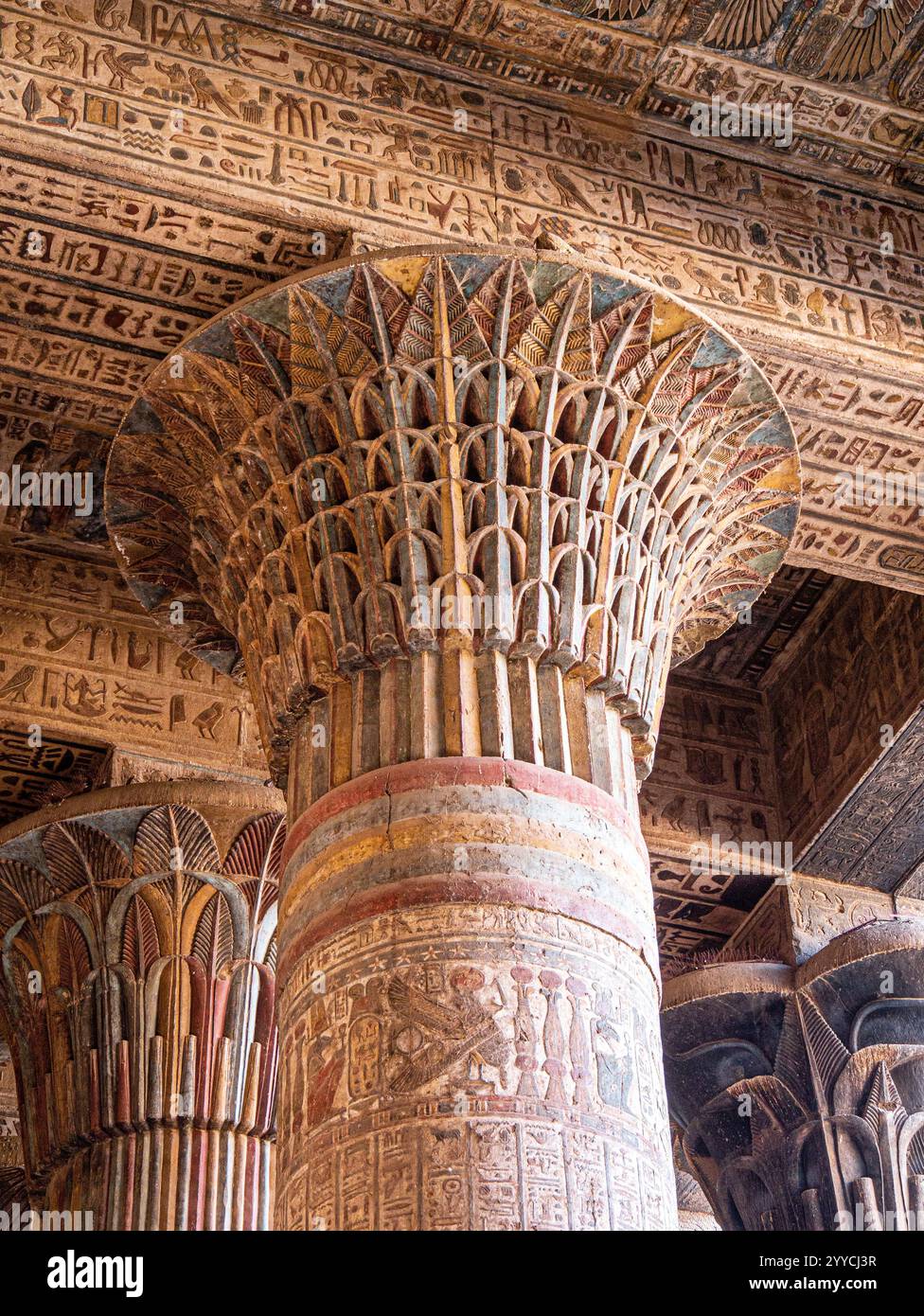 Pillar covered in hieroglyphs and carvings inside Khnum Temple in Esna ...
