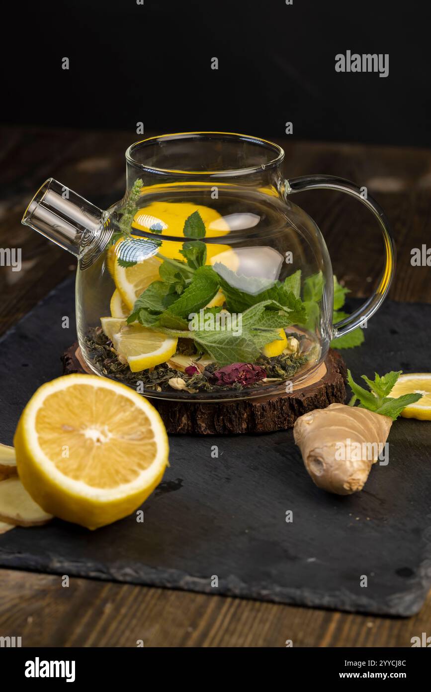 preparation of green tea in a glass teapot, green tea with ginger and ...