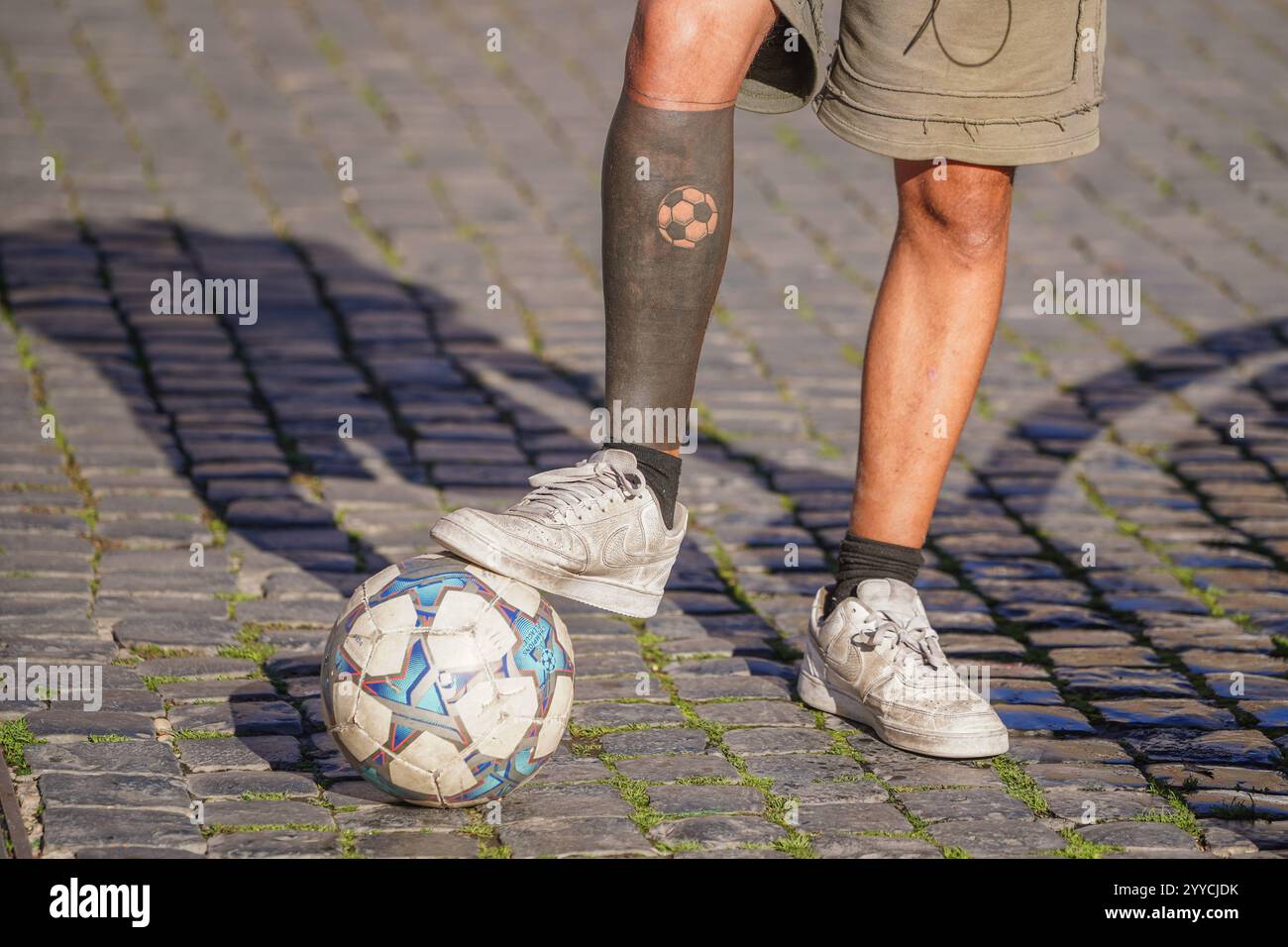 A tattoo on the leg of a soccer player, Rome, Italy Stock Photo - Alamy